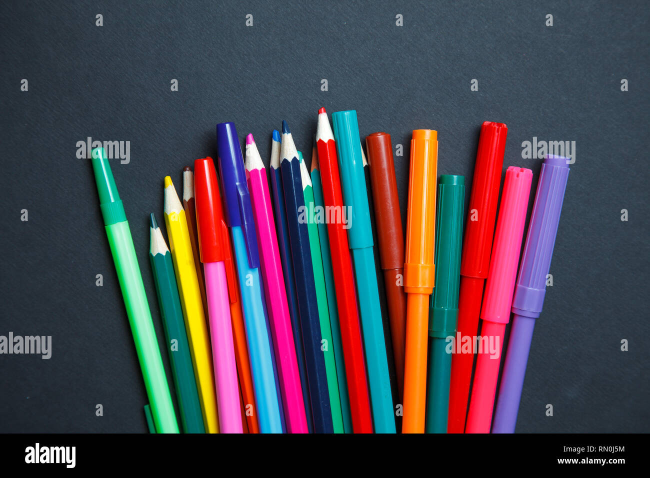 Color pencils on dark background. Top view with copy space Stock Photo ...