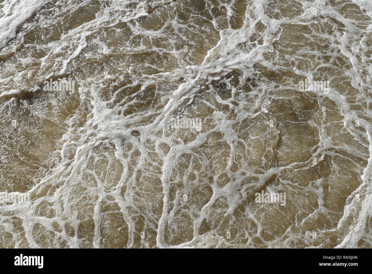 Foaming water in a river Stock Photo - Alamy