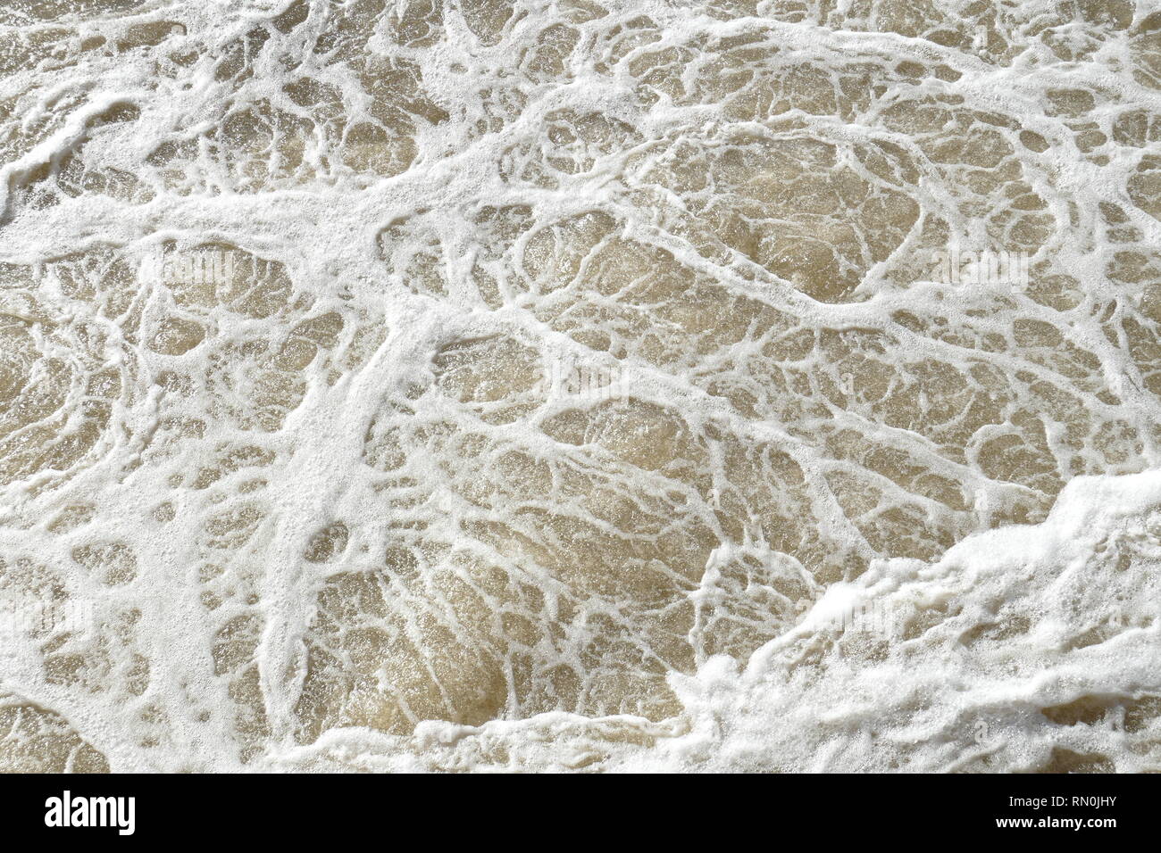 Foaming water in a river Stock Photo - Alamy