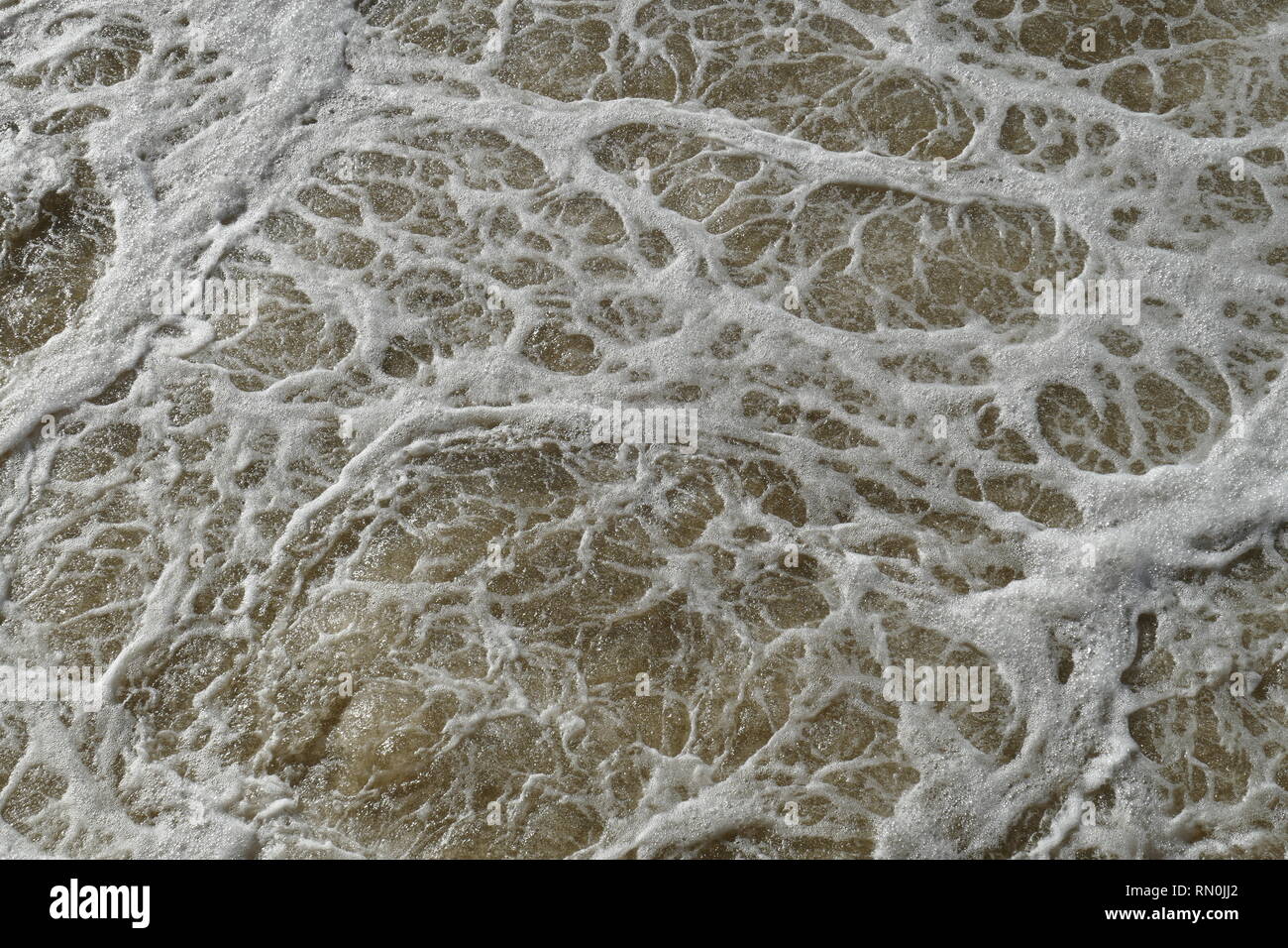 Foaming water in a river Stock Photo - Alamy