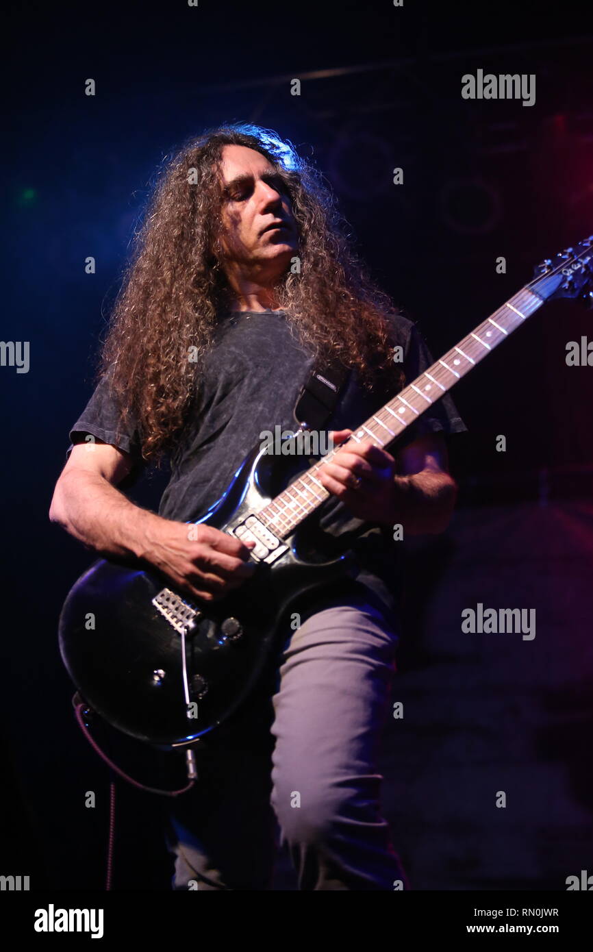 Guitarist Jim Matheos is shown performing on stage during a "live ...