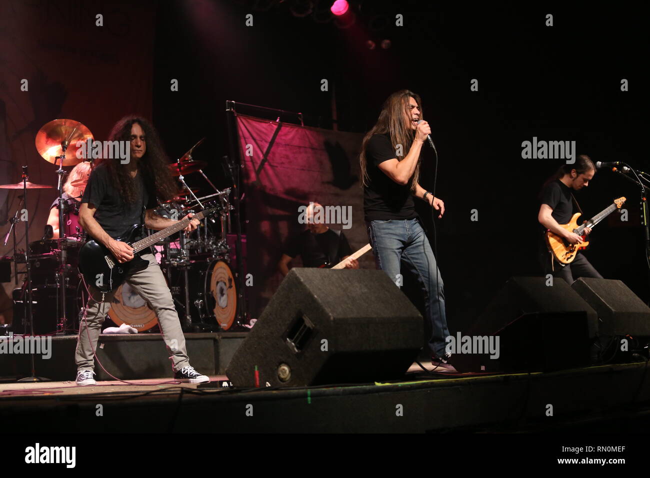 Fates Warning are shown performing on stage during a "live" concert ...