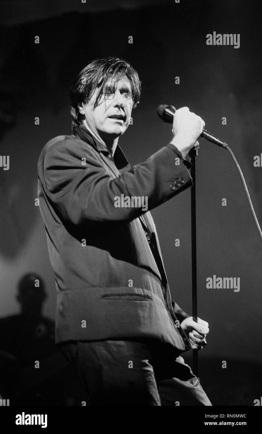 Singer Bryan Ferry is shown performing on stage during a "live" concert ...