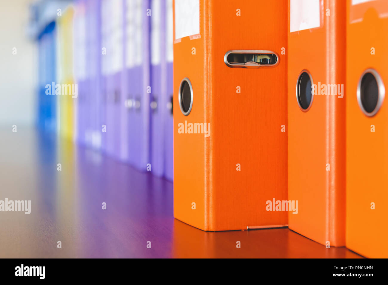 A row of binders for documents in the office Stock Photo - Alamy