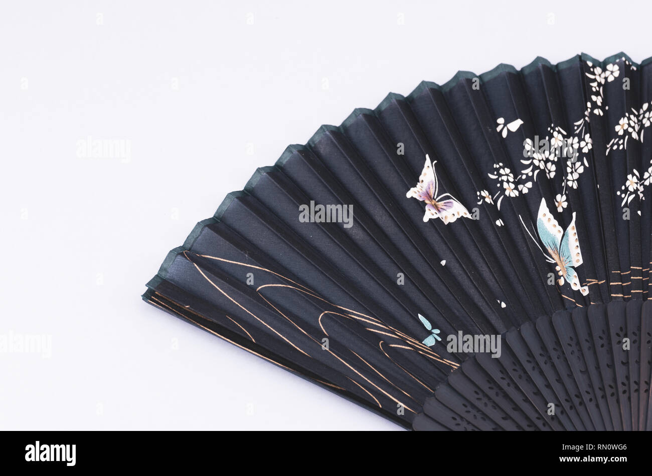 open dark blue floral theme decorated handheld folding fan Stock Photo ...