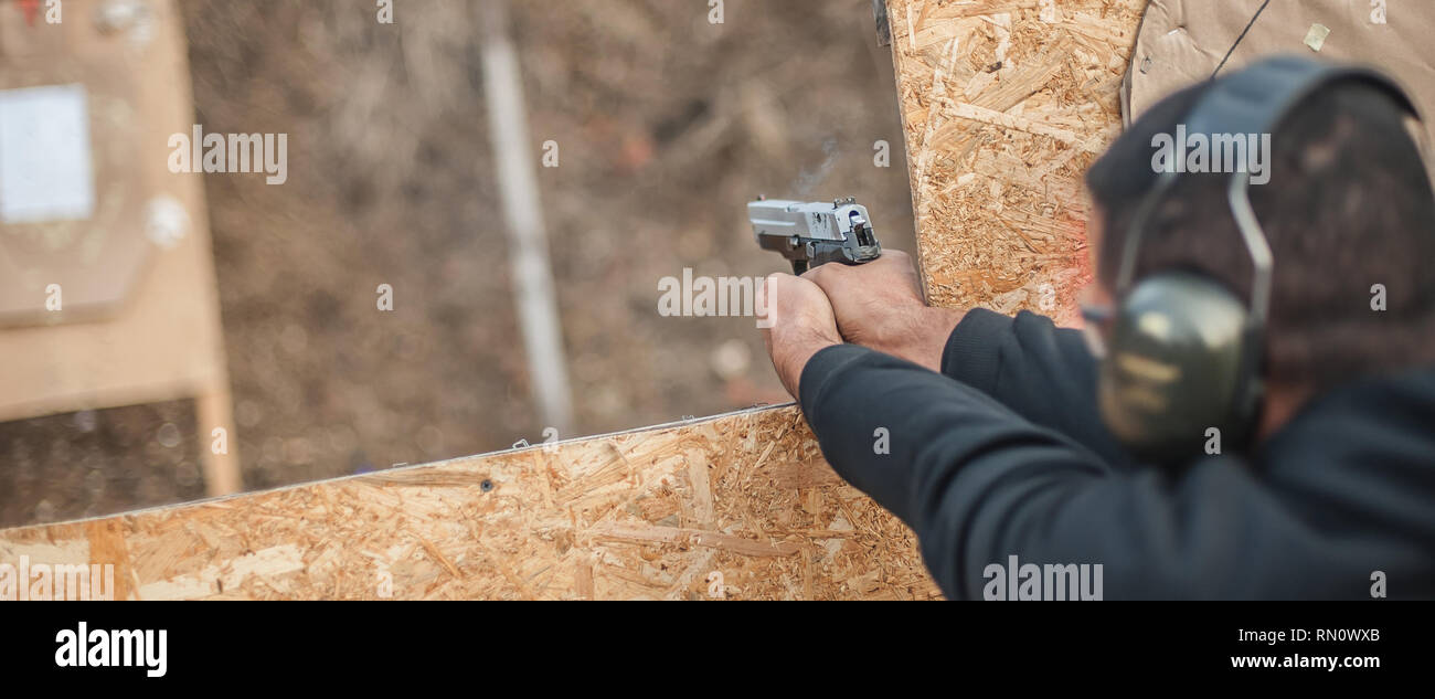 Advanced outdoor tactical shooting on target around barrier and wall ...