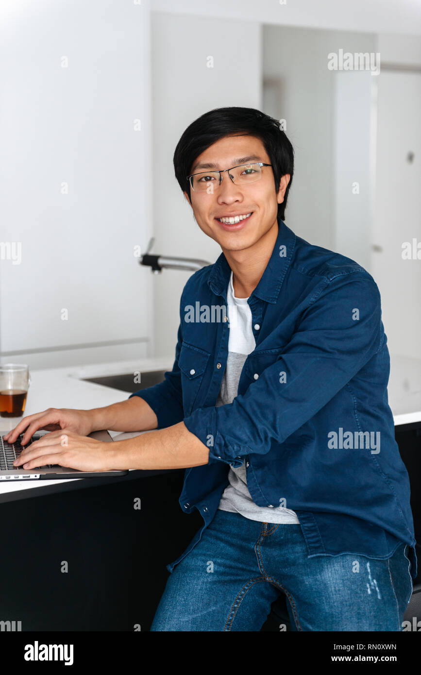 Asian man working on laptop hi-res stock photography and images - Alamy