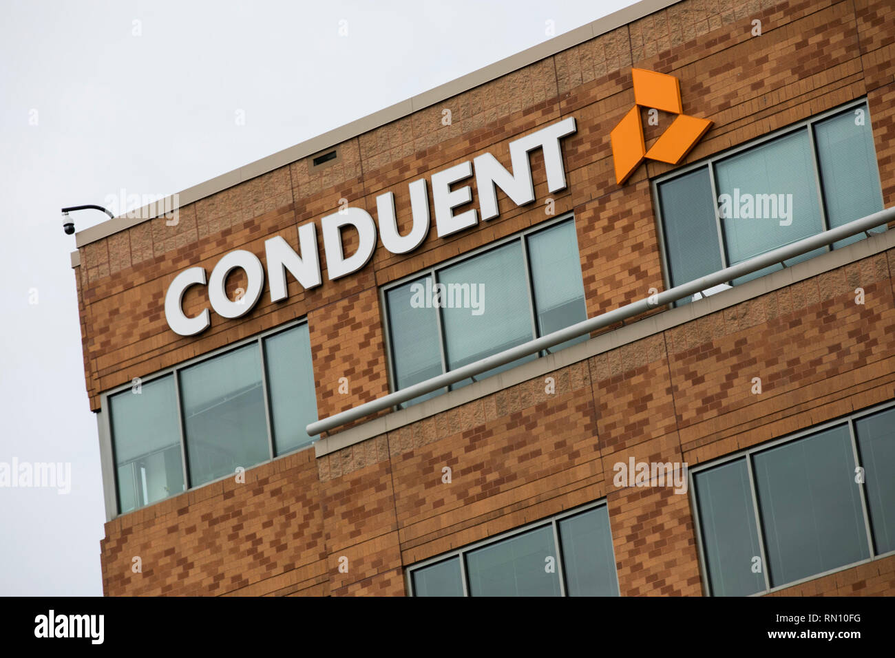 A logo sign outside of a facility occupied by Conduent in Germantown ...