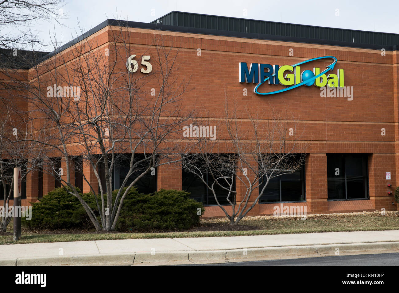 A logo sign outside of a facility occupied by MRIGlobal in Gaithersburg ...