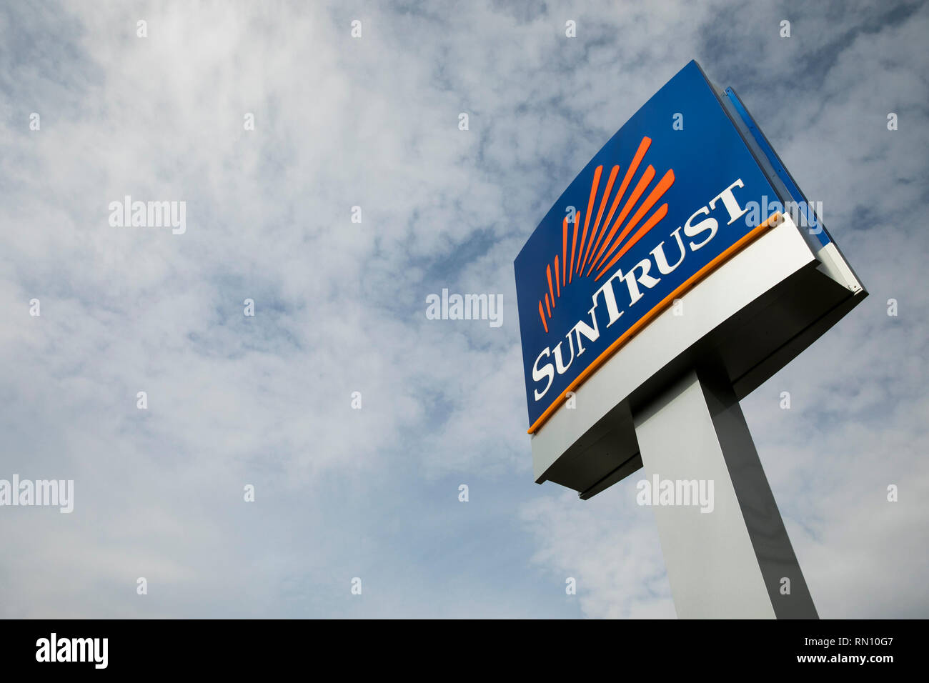 A logo sign outside of a SunTrust Bank branch in Gaithersburg, Maryland ...