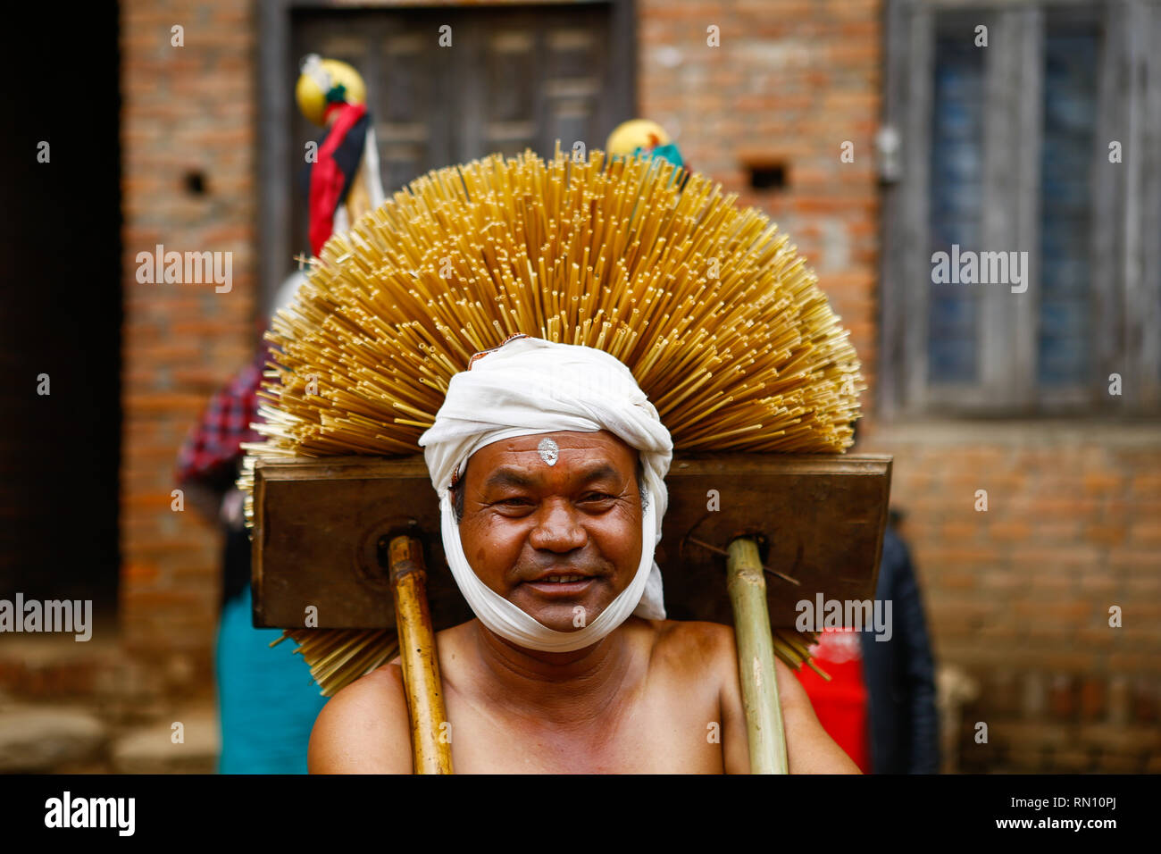 A devotee seen in cultural attire smiling while walking around the ...