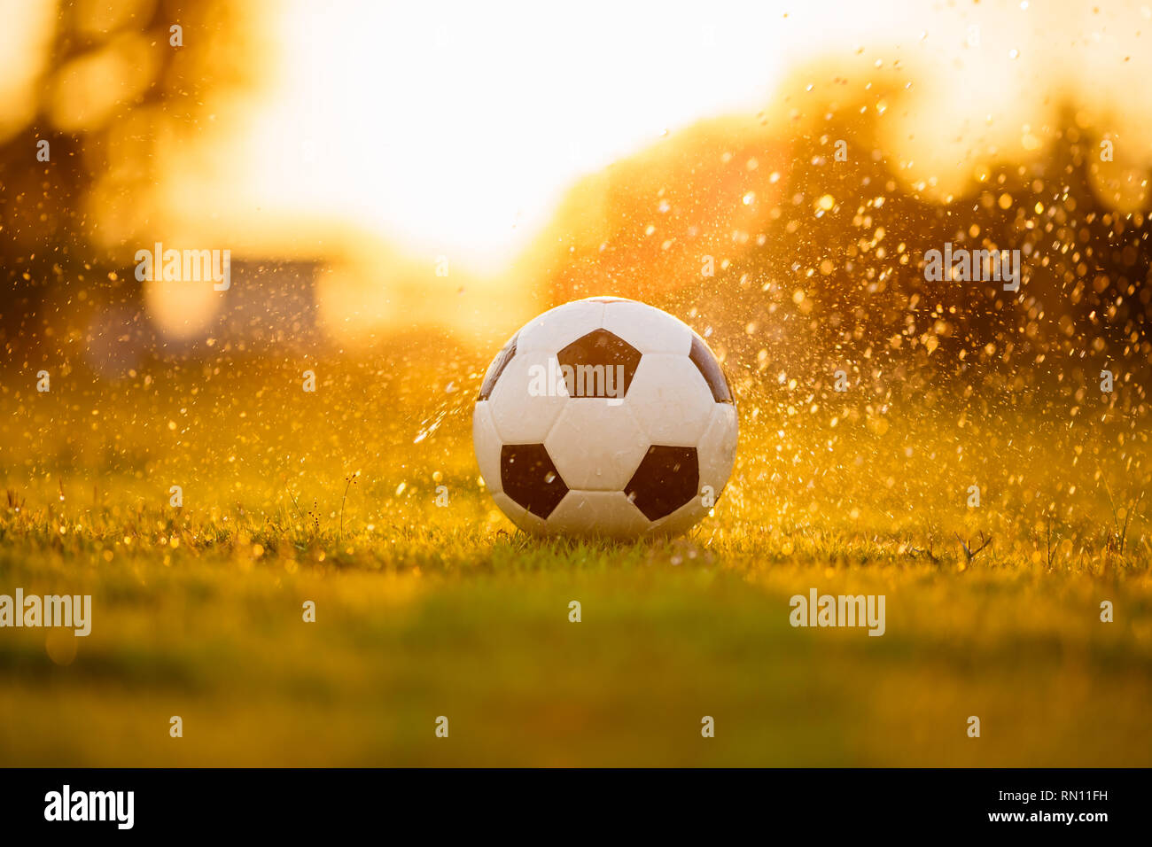 Kid park rain football hi-res stock photography and images - Alamy