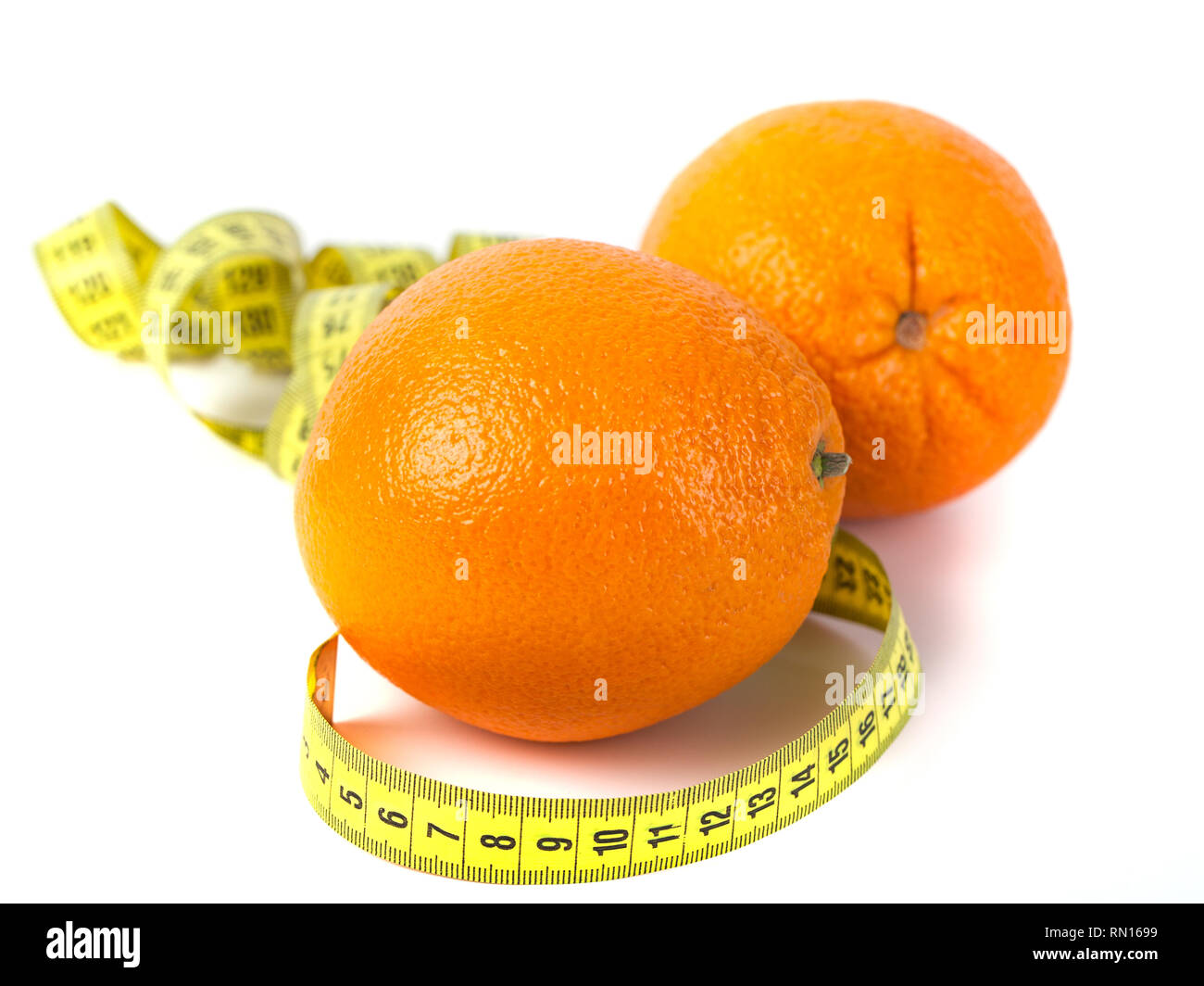 Orange Fruit with measurement isolated on white. Concept of dieting and ...