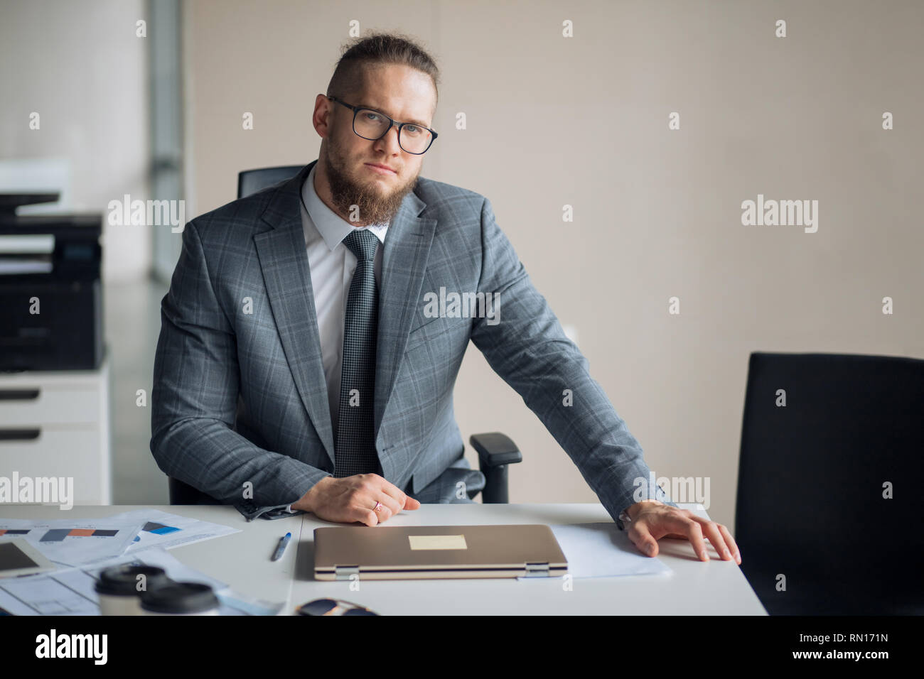 hardworking leader of company looking at the camera. close up shot ...