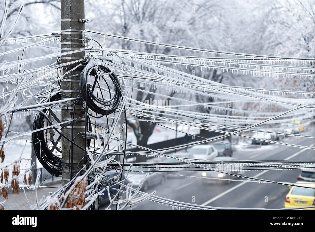 Electricity cables covered in ice after frozen rain phenomenon Stock ...