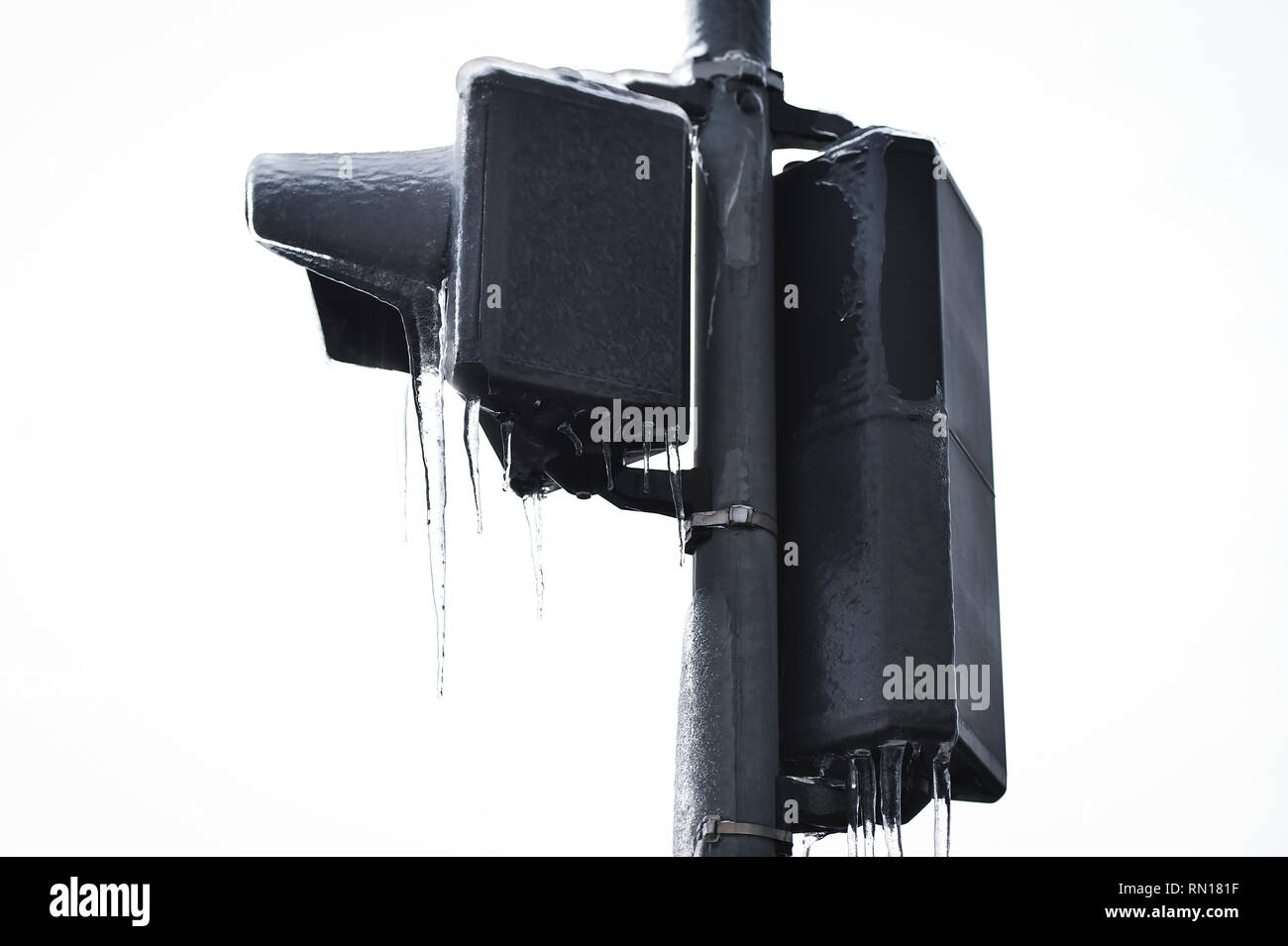 Street traffic lights covered in ice after frozen rain phenomenon Stock ...
