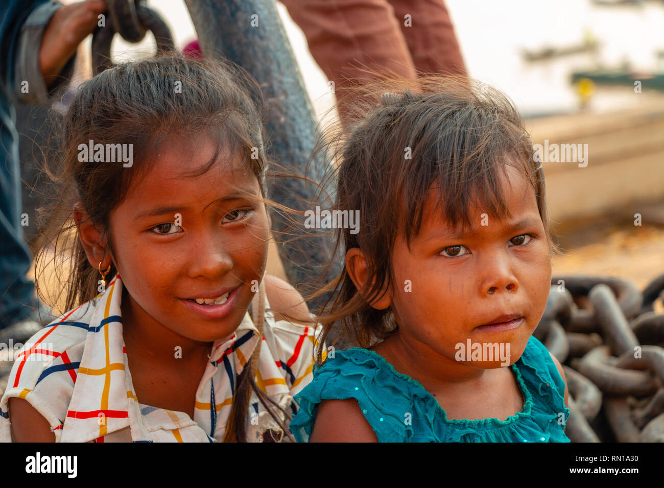 Portrait of a cute, happy,smiling, young, local, primary school age ...