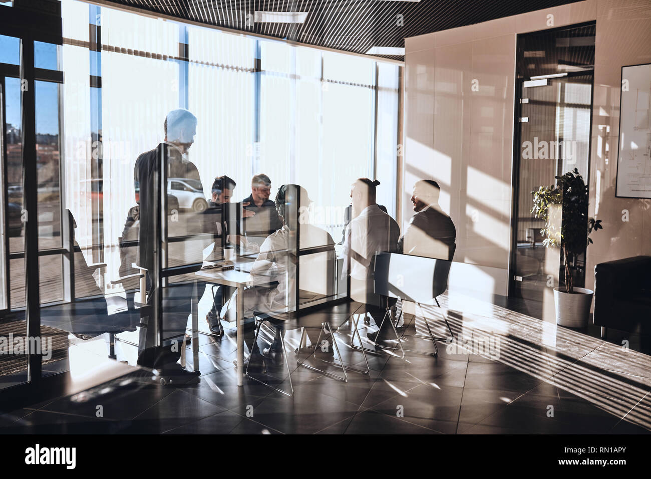 Management office behind glass wall hi-res stock photography and images ...