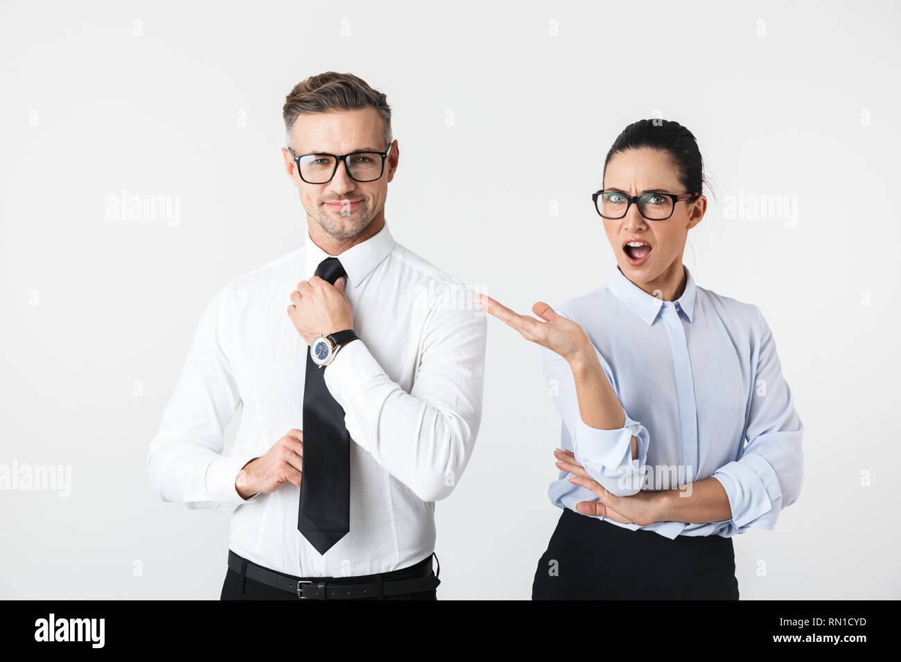 Image of displeased business colleagues couple isolated over white wall ...