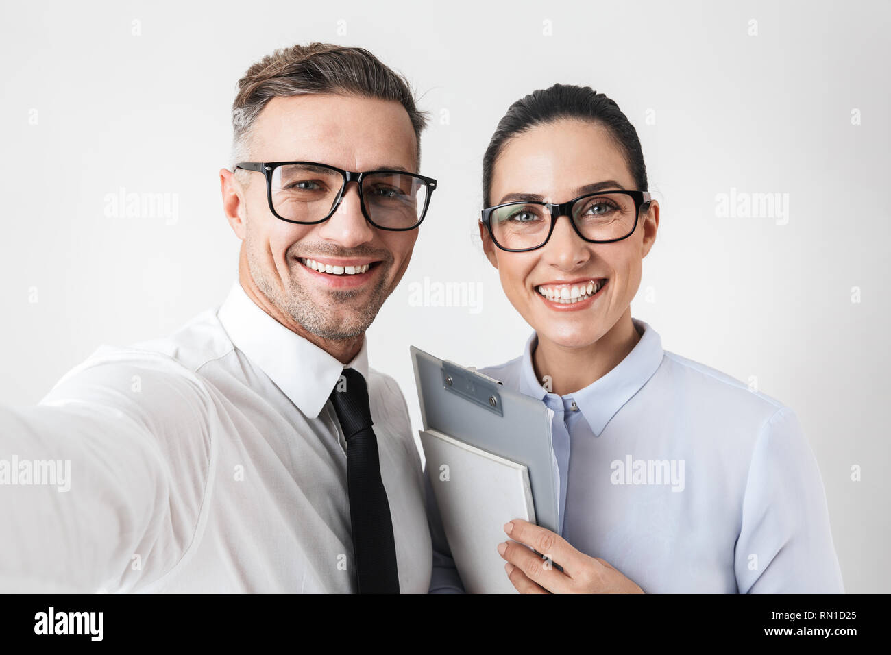 Photo of happy business colleagues couple isolated over white wall ...