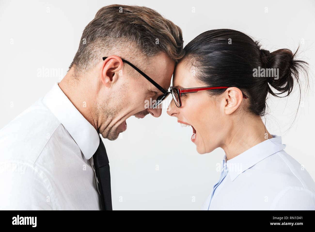 Image of young angry business colleagues couple isolated over white ...
