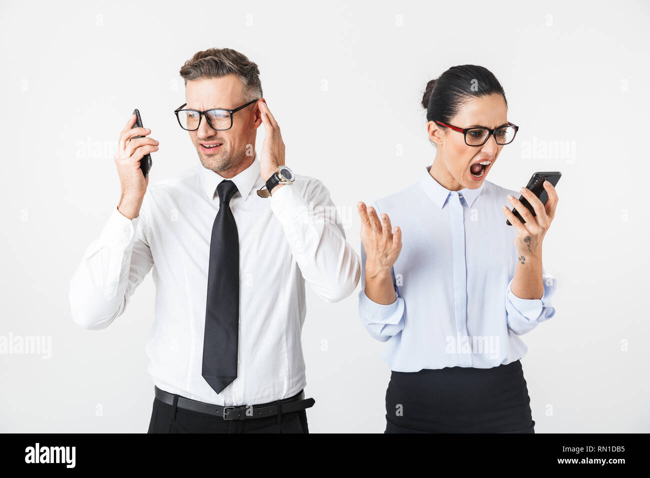 Image of young angry screaming business colleagues couple isolated over ...
