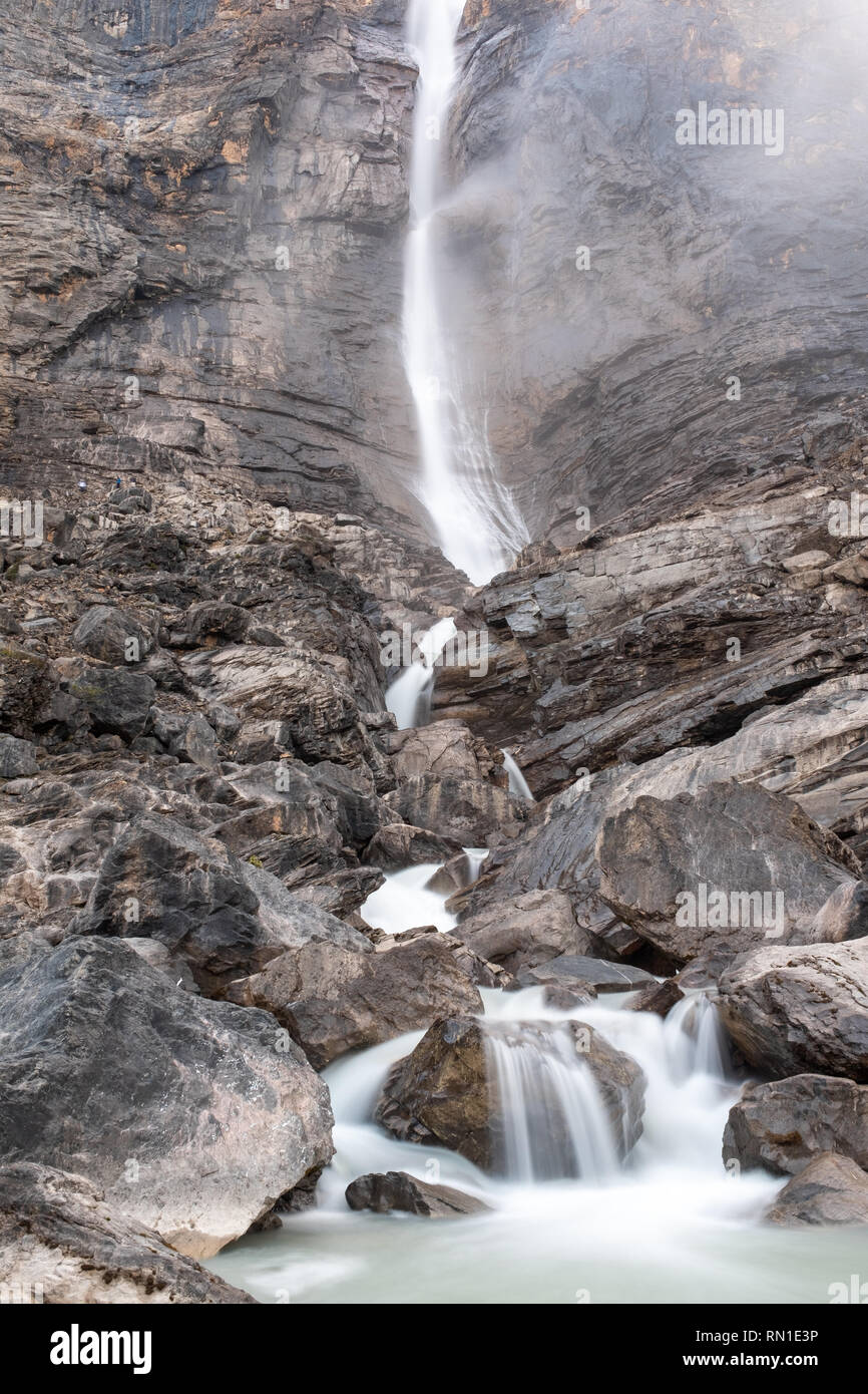 A close up of a large waterfall drop, shot on a slow shutter speed with ...