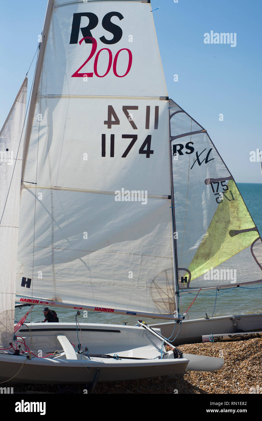 Sails billowing in the wind on the beach Stock Photo - Alamy