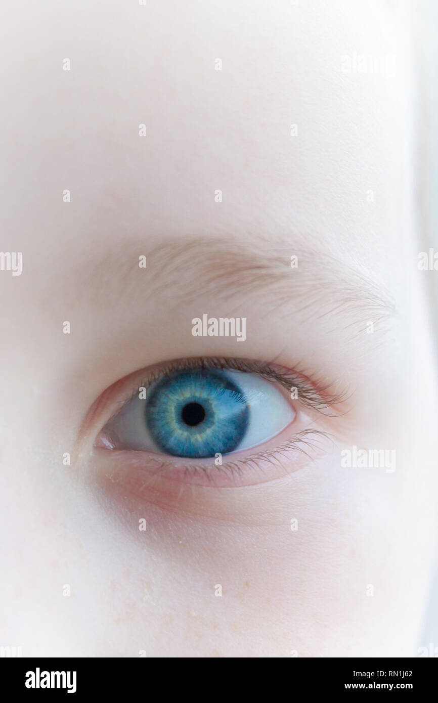 Baby blue beautiful, brooding eyes of a boy Stock Photo - Alamy