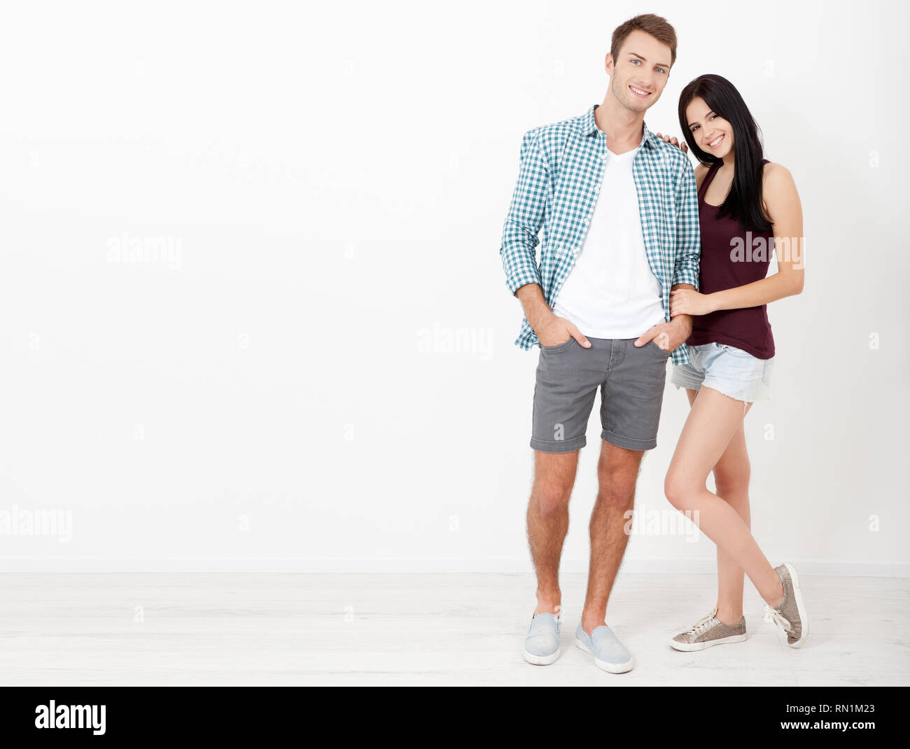 Young couple in love over isolated background very happy and excited ...