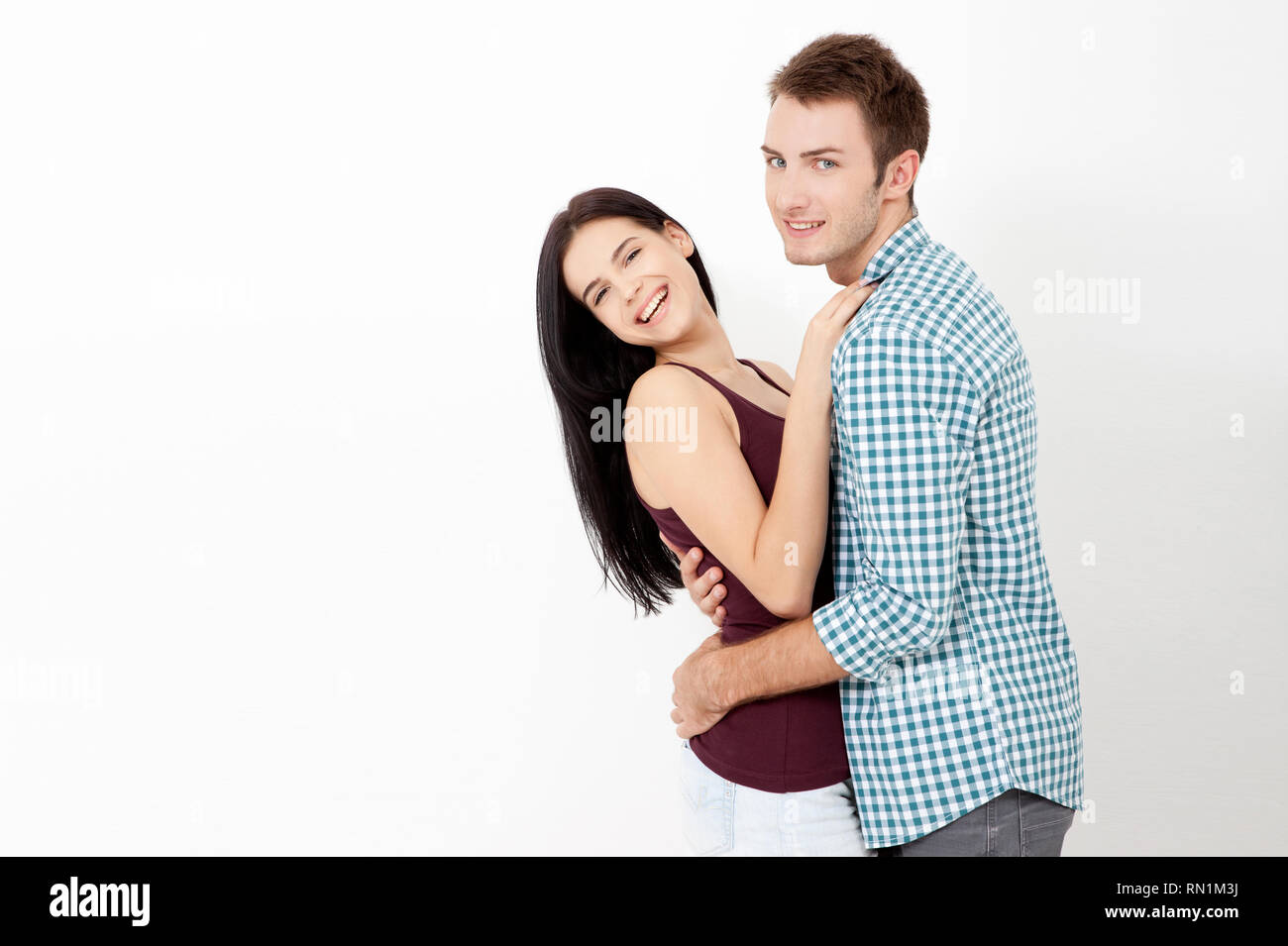 Young couple in love over isolated background very happy and excited ...