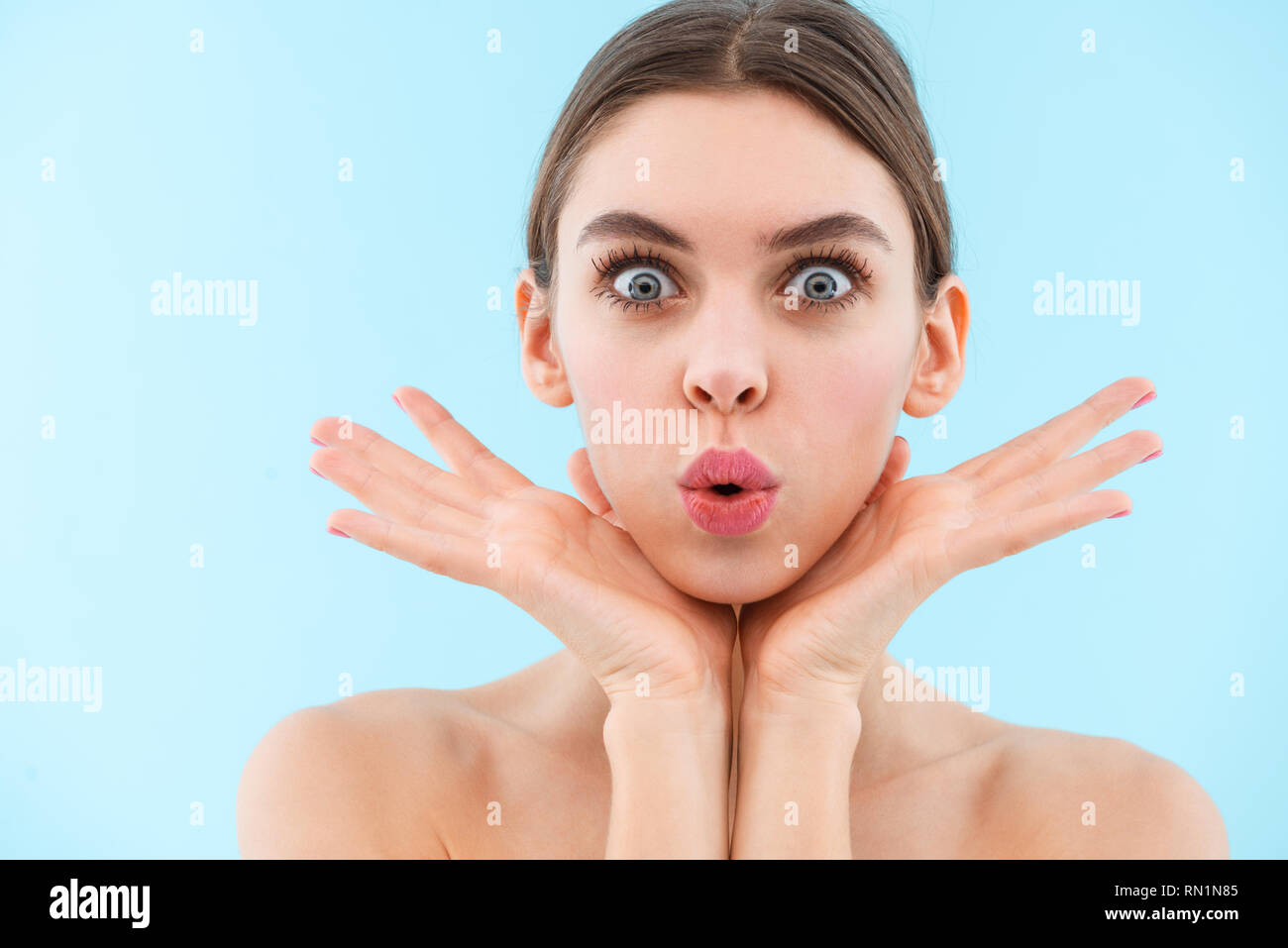 Image Of Shocked Beautiful Young Woman Posing Isolated Over Blue