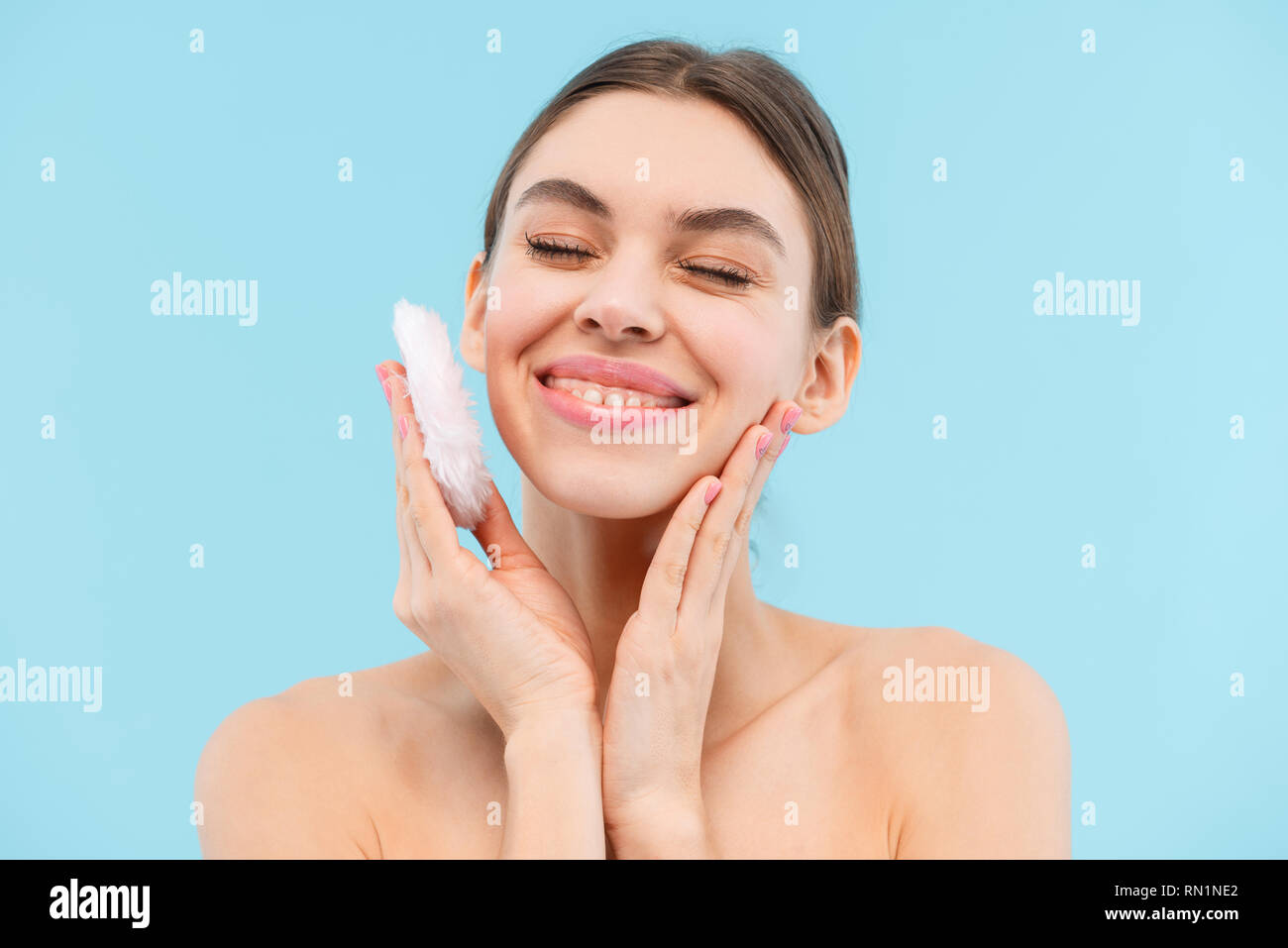 Photo of beautiful happy young woman posing isolated over blue ...
