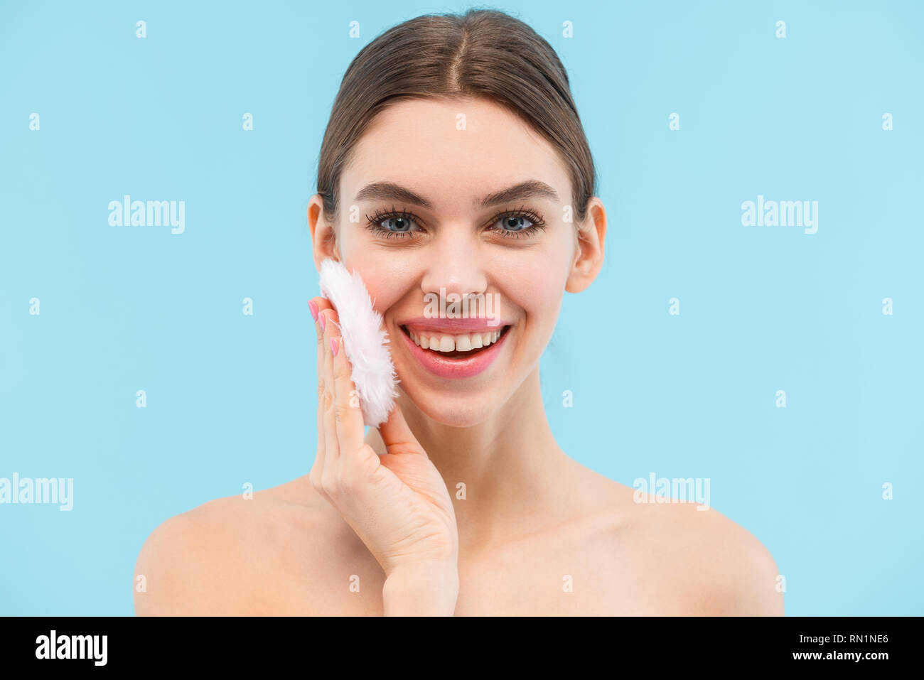 Photo of beautiful happy young woman posing isolated over blue ...