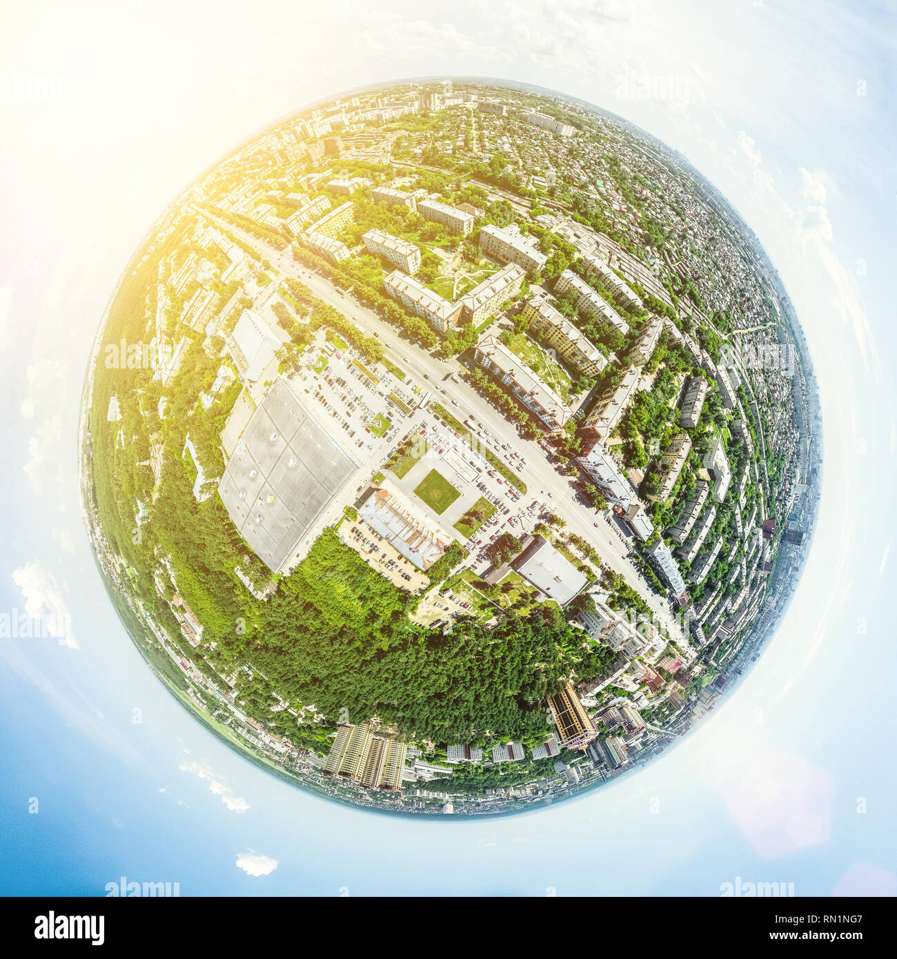 Aerial city view with crossroads and roads, houses, buildings, parks ...