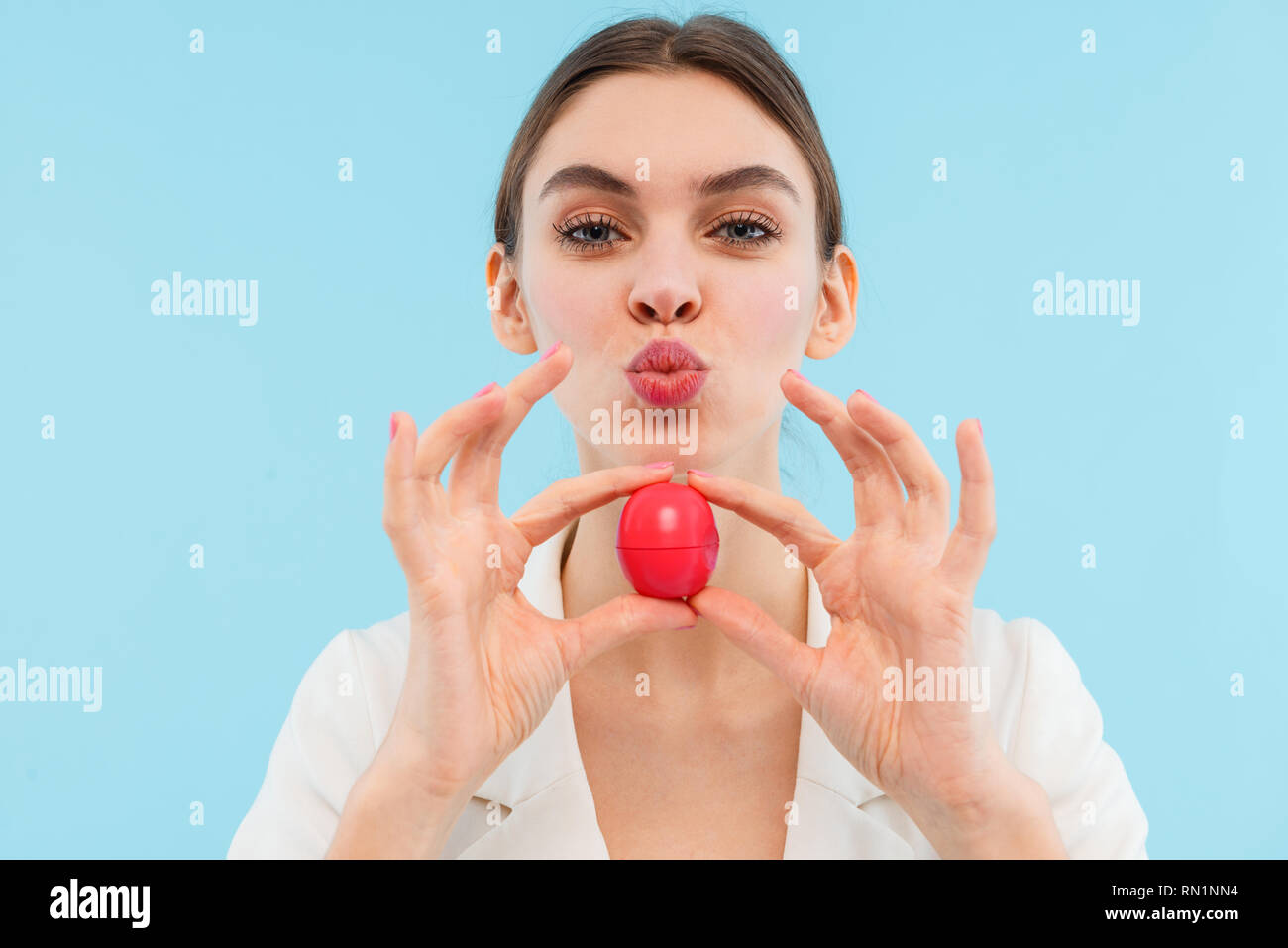Photo of beautiful young woman posing isolated over blue background ...