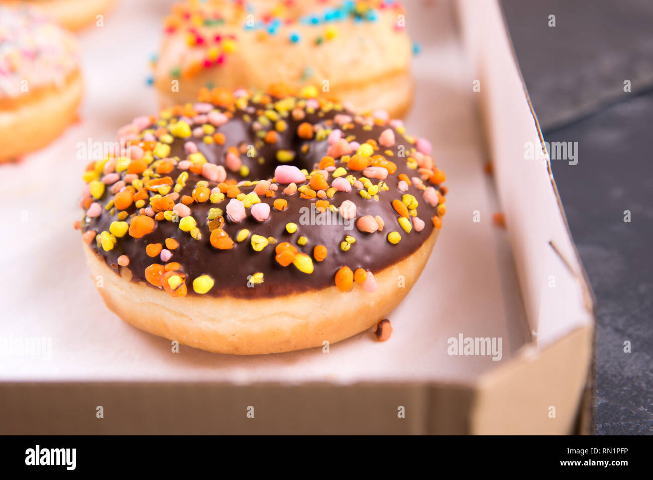 box of sweet fresh donuts with filling Stock Photo - Alamy