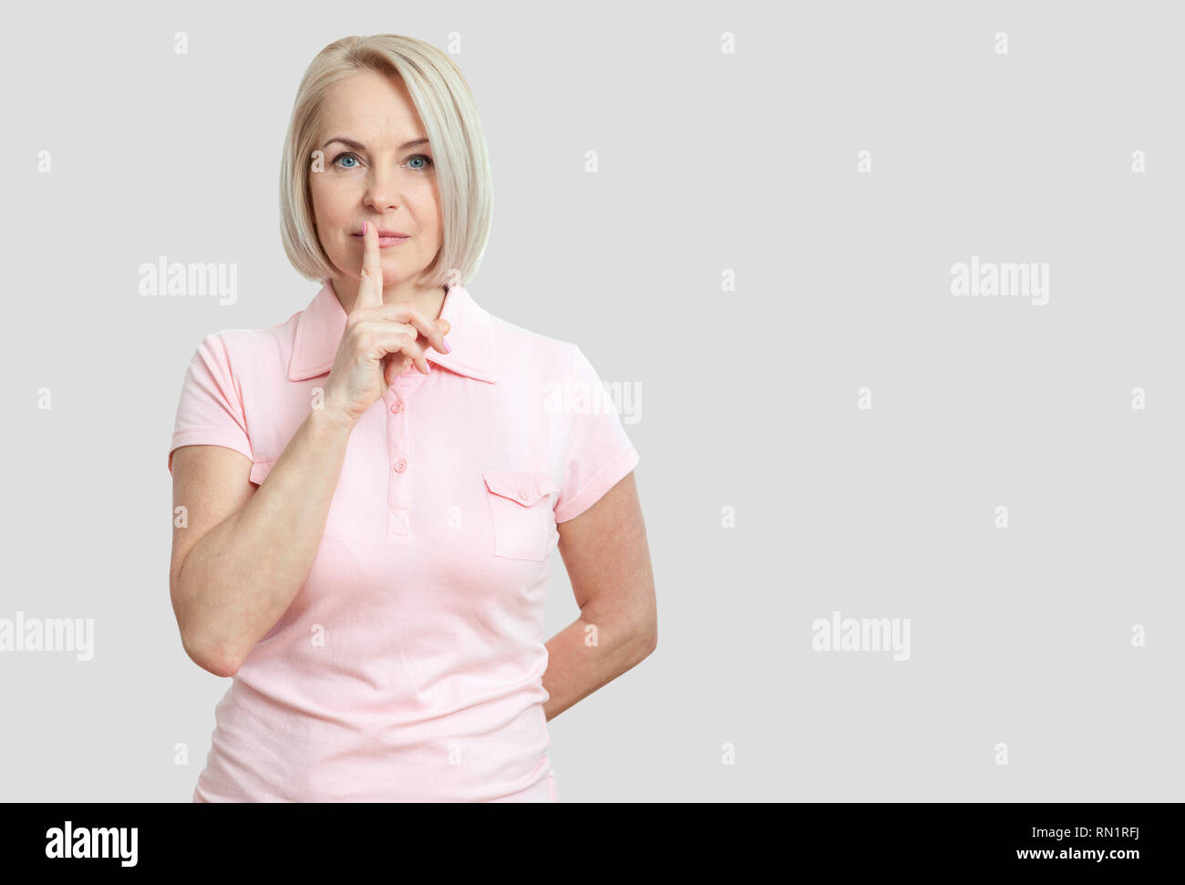 Portrait beautiful woman with finger on lips, or secret gesture hand ...