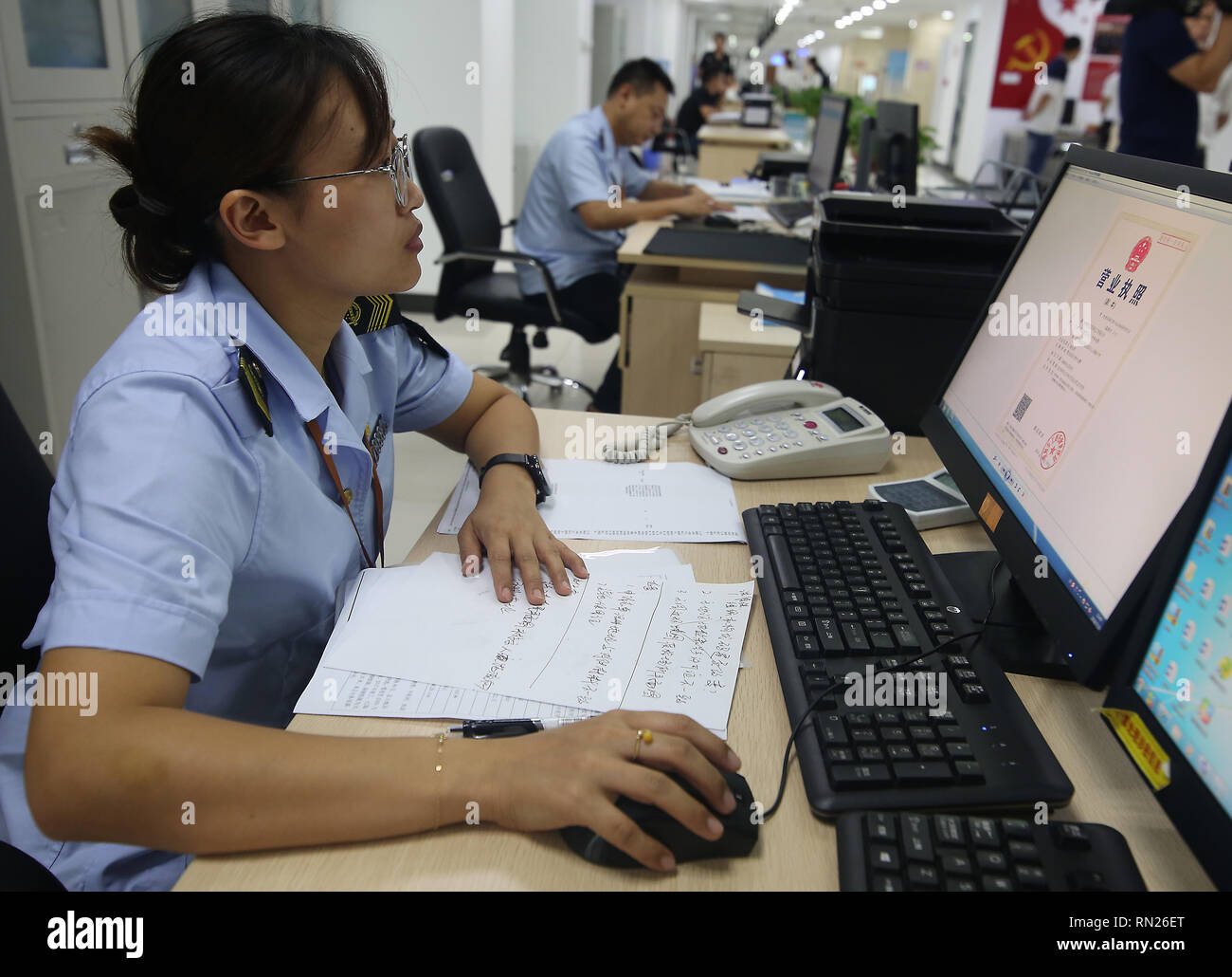 July 7, 2018 - Shenyang, Liaoning, China - Government officers work at ...