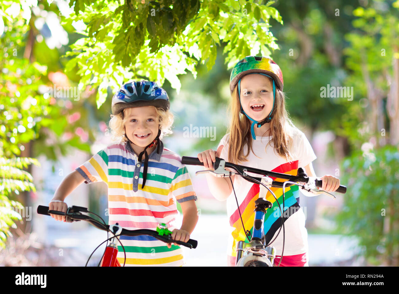 Children going school bicycle in hi-res stock photography and images ...