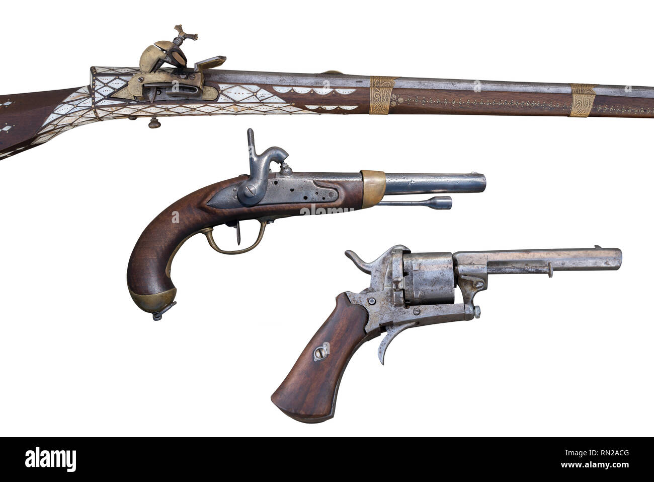 Antique flintlock rifle, percussion pistols and revolver. Evolution of ...