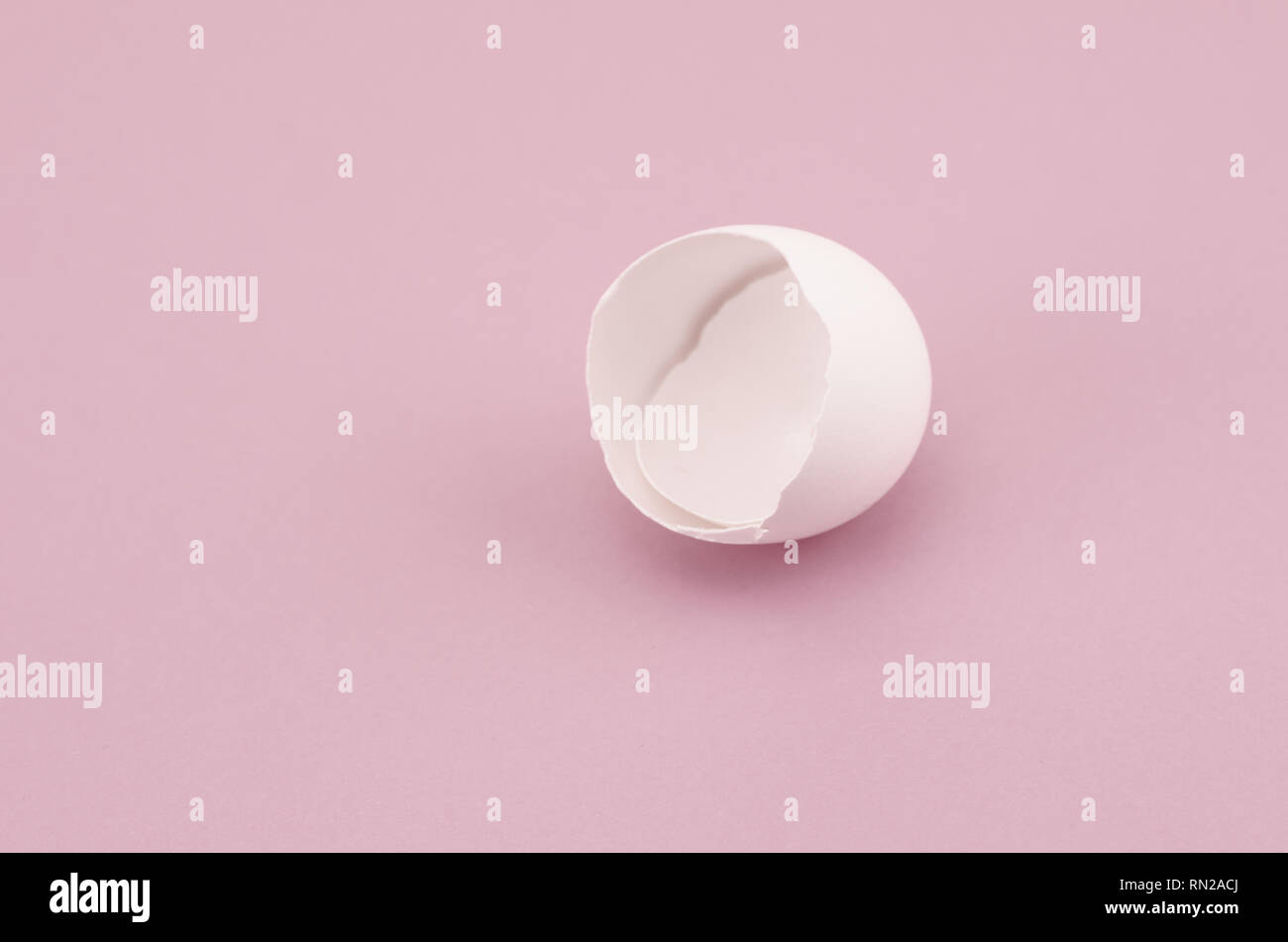 white empty broken egg shell on a pastel colored surface Stock Photo ...