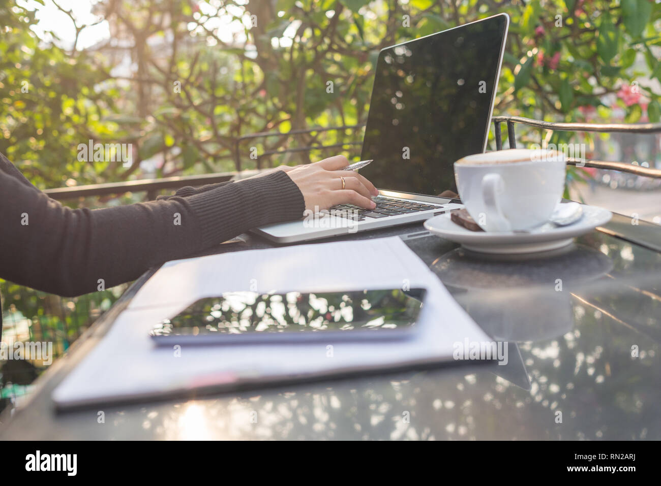 Young woman working under the morning sunshine Stock Photo - Alamy