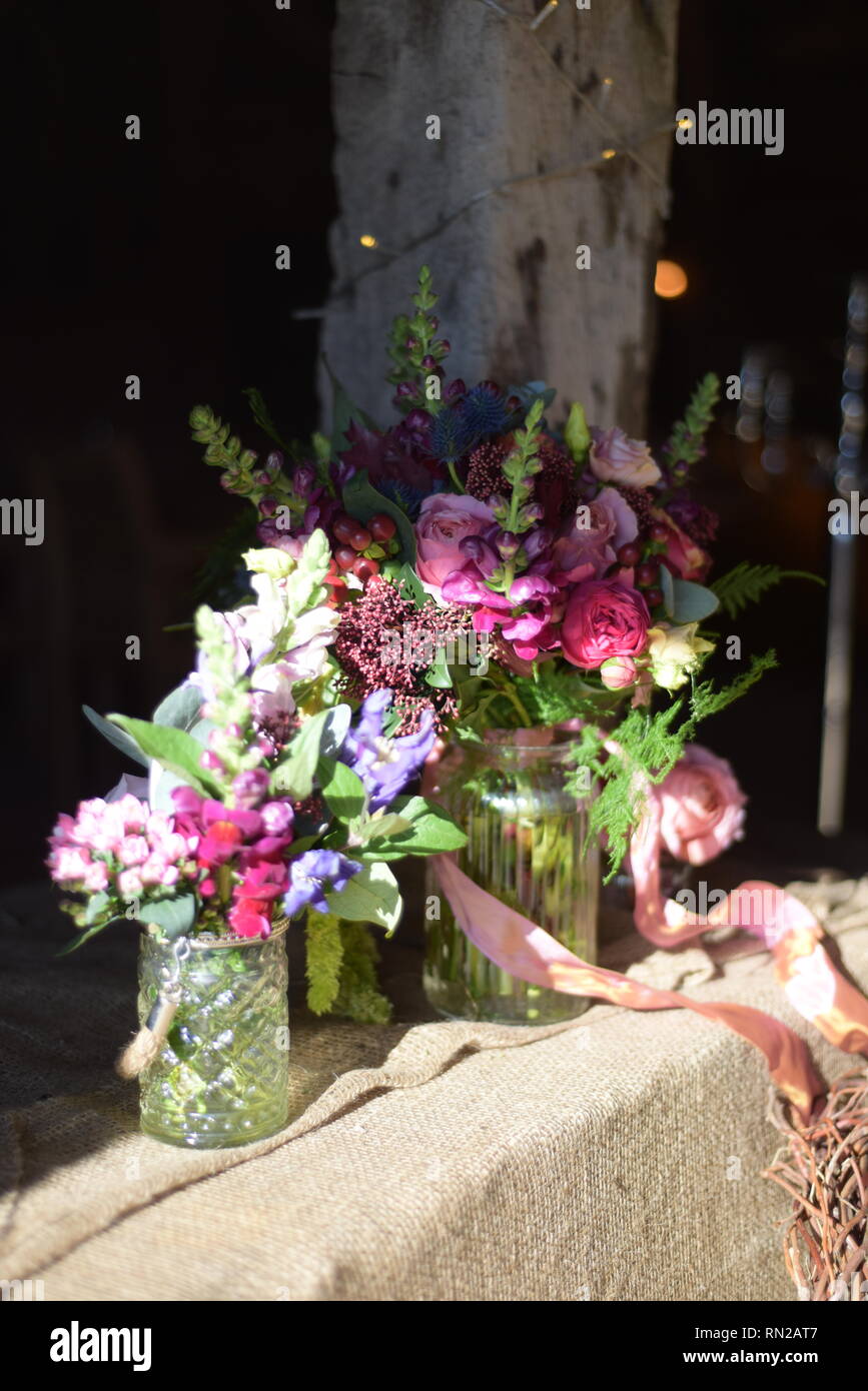 Beautiful vibrant cut flowers in a display in a strong low natural ...