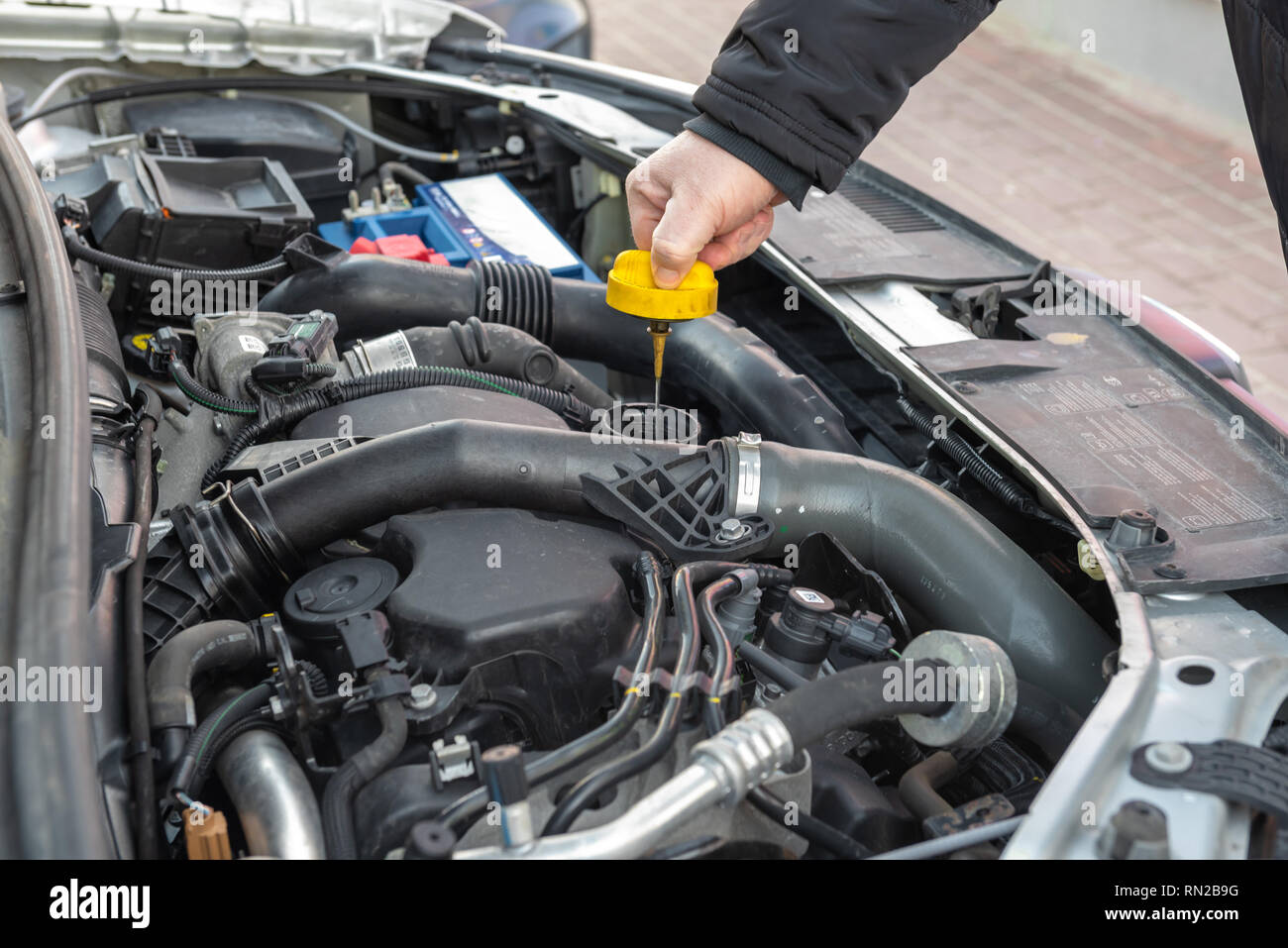 Checking oil level hi-res stock photography and images - Alamy