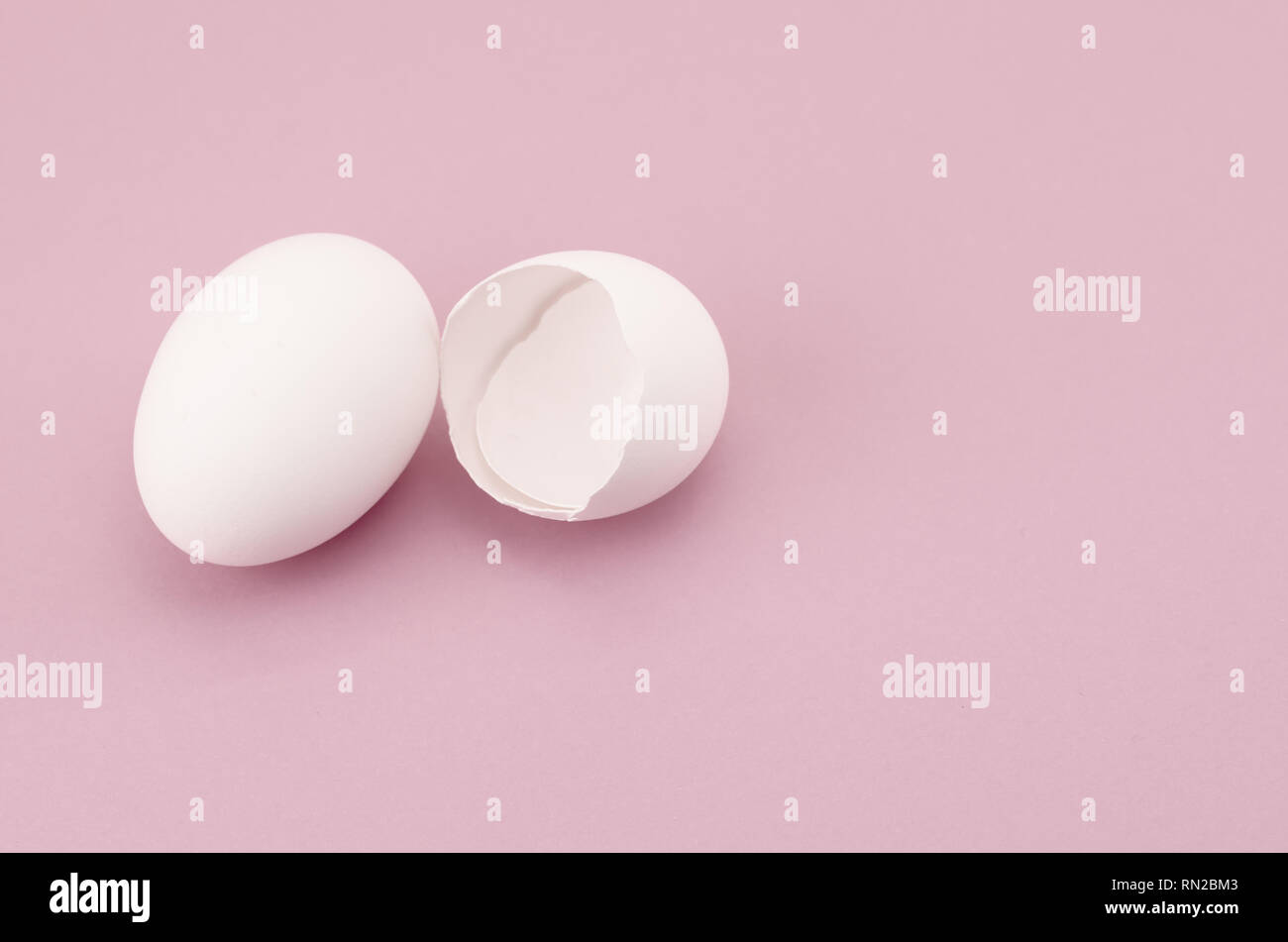 white empty broken egg shell on a pastel colored surface Stock Photo ...