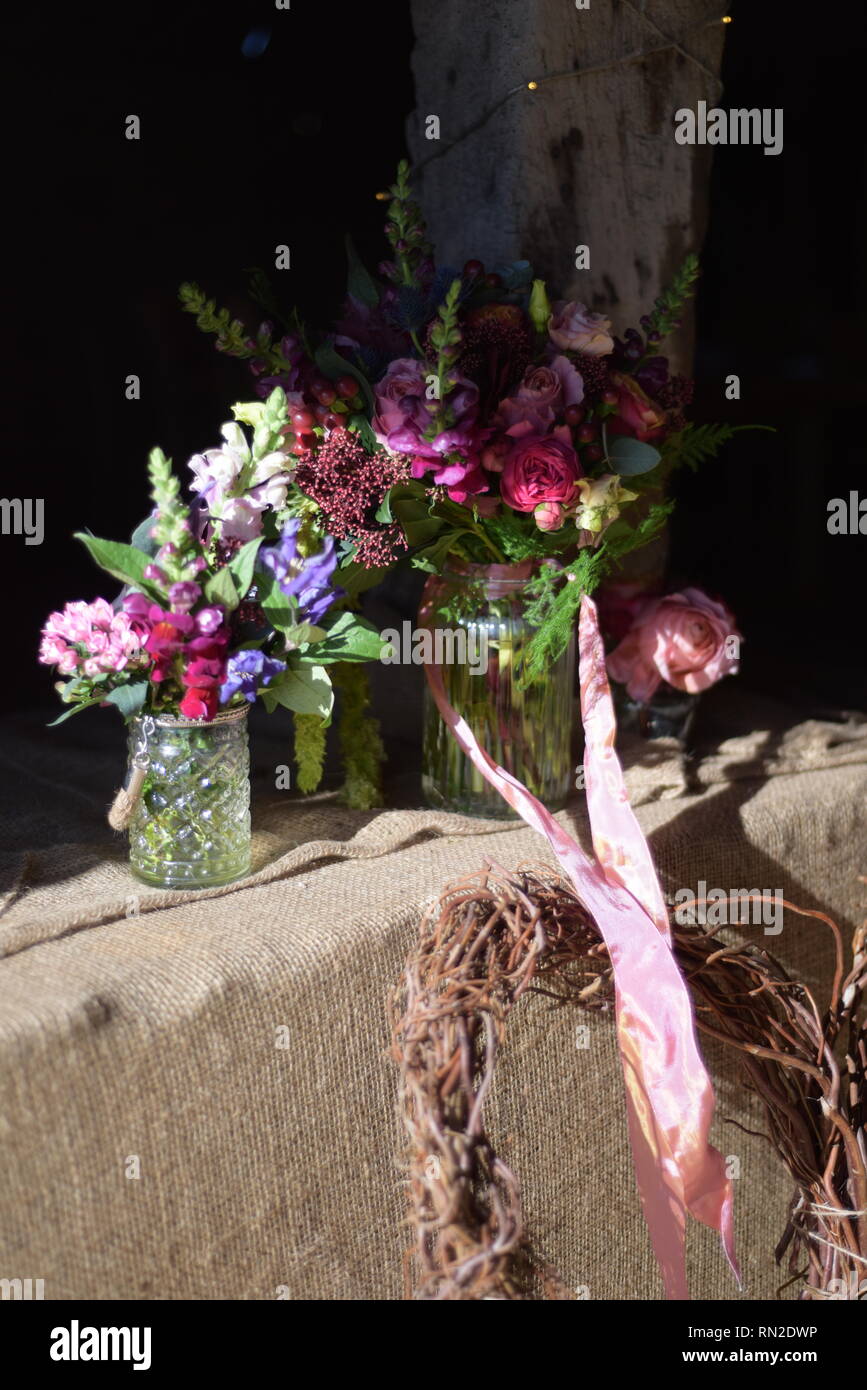 Beautiful vibrant cut flowers in a display in a strong low natural ...