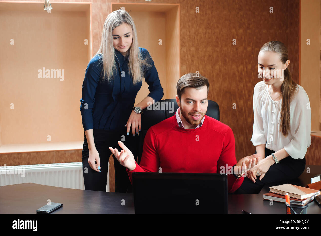 Businesspeople using laptop at conference table Stock Photo - Alamy Businesspeople using laptop at conference table Stock Photo - Alamy