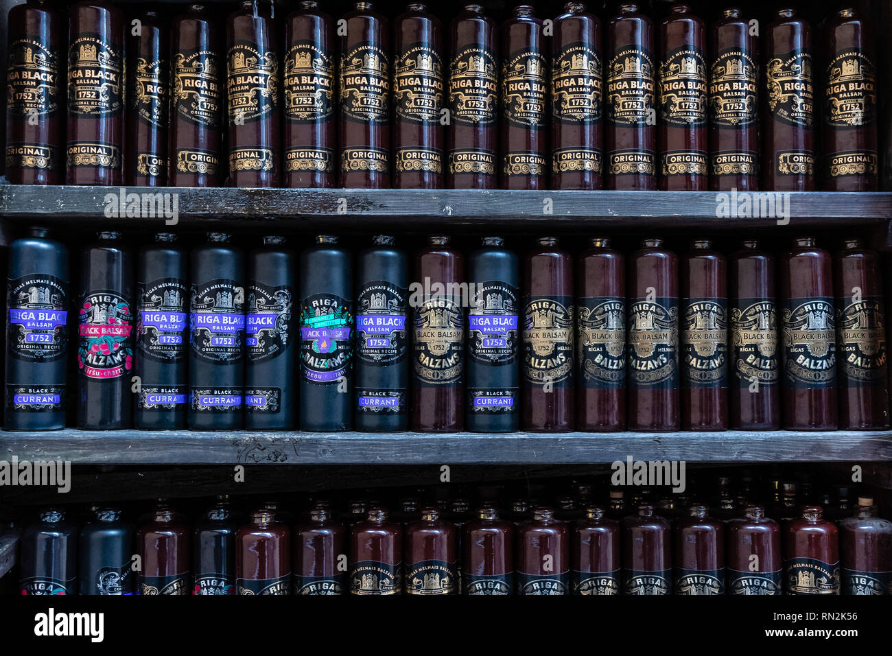 RIGA, LATVIA - JANUARY 18, 2019: Shelves with Riga black balsam ceramic ...