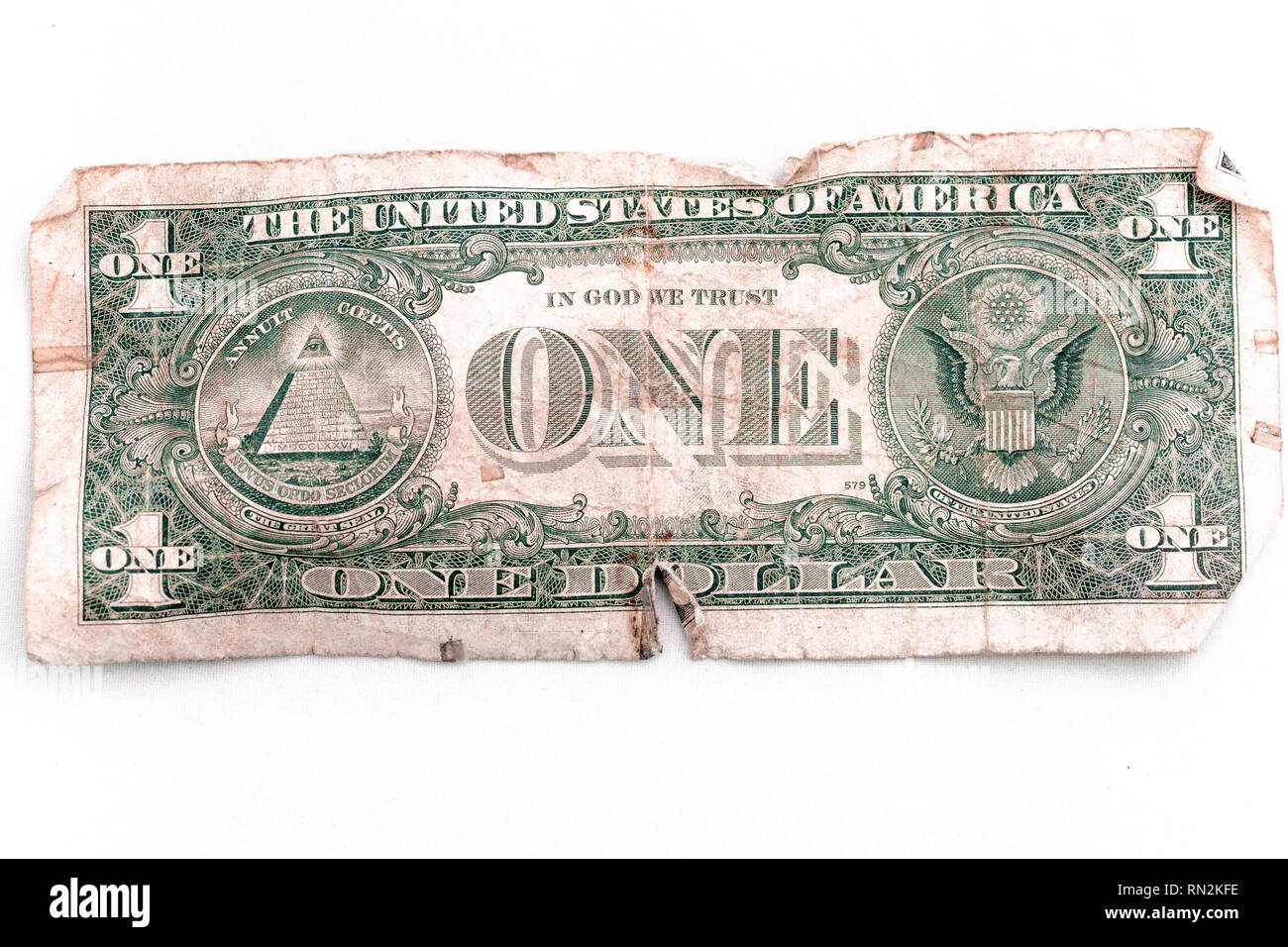 Rear of an old wrinkled used banknote of one US dollar on a white ...